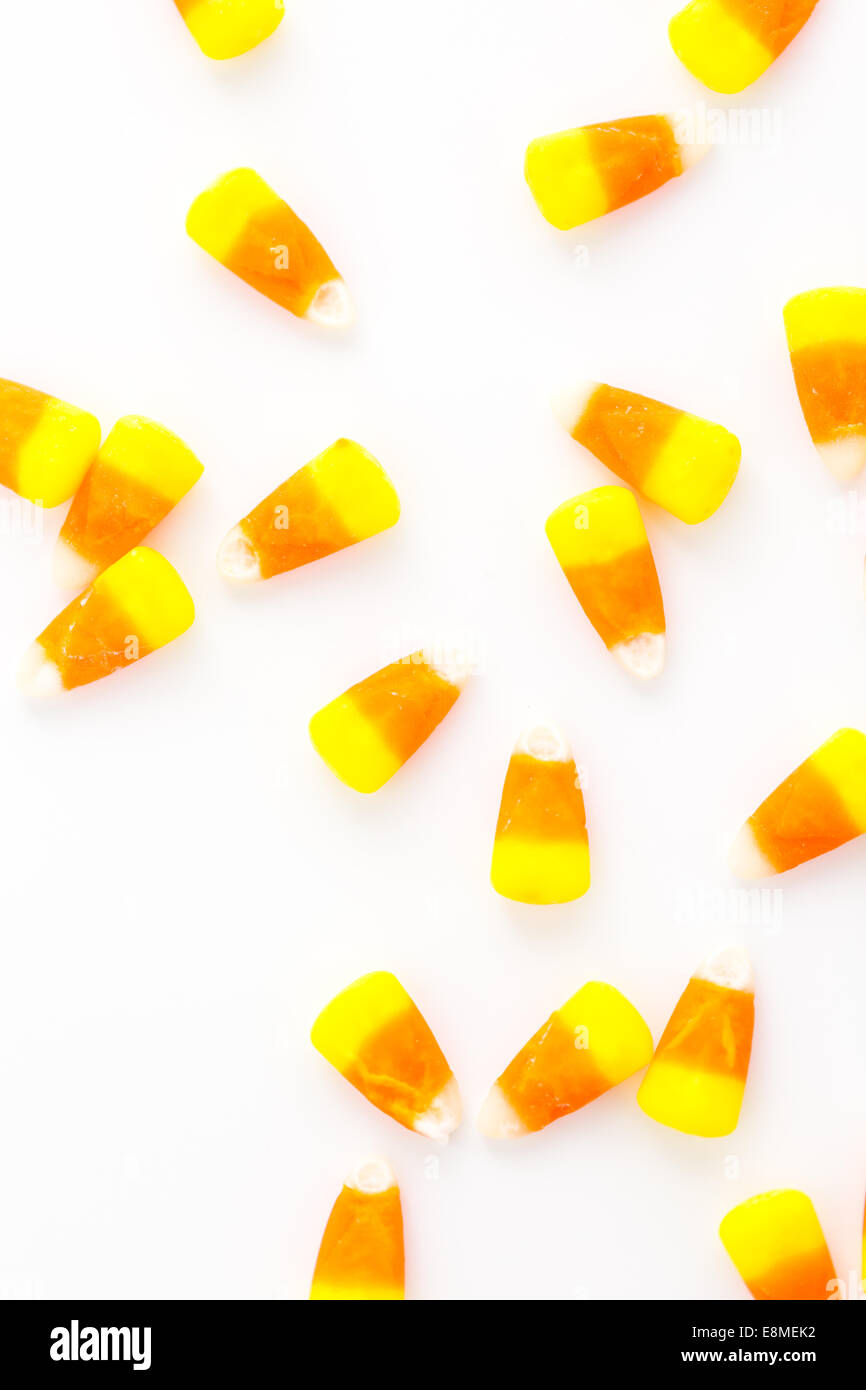 Candy corn candies on a white background Stock Photo - Alamy
