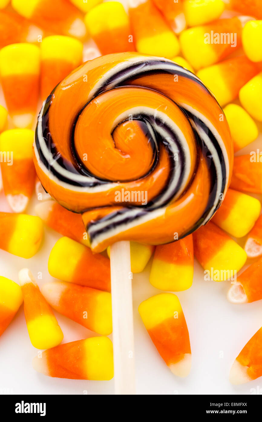 Handmade twist lollipop with orange and black stripes Stock Photo - Alamy