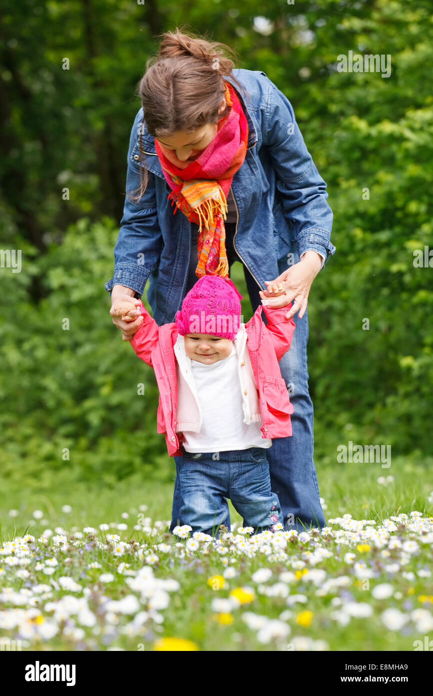 Baby's first steps Stock Photo - Alamy