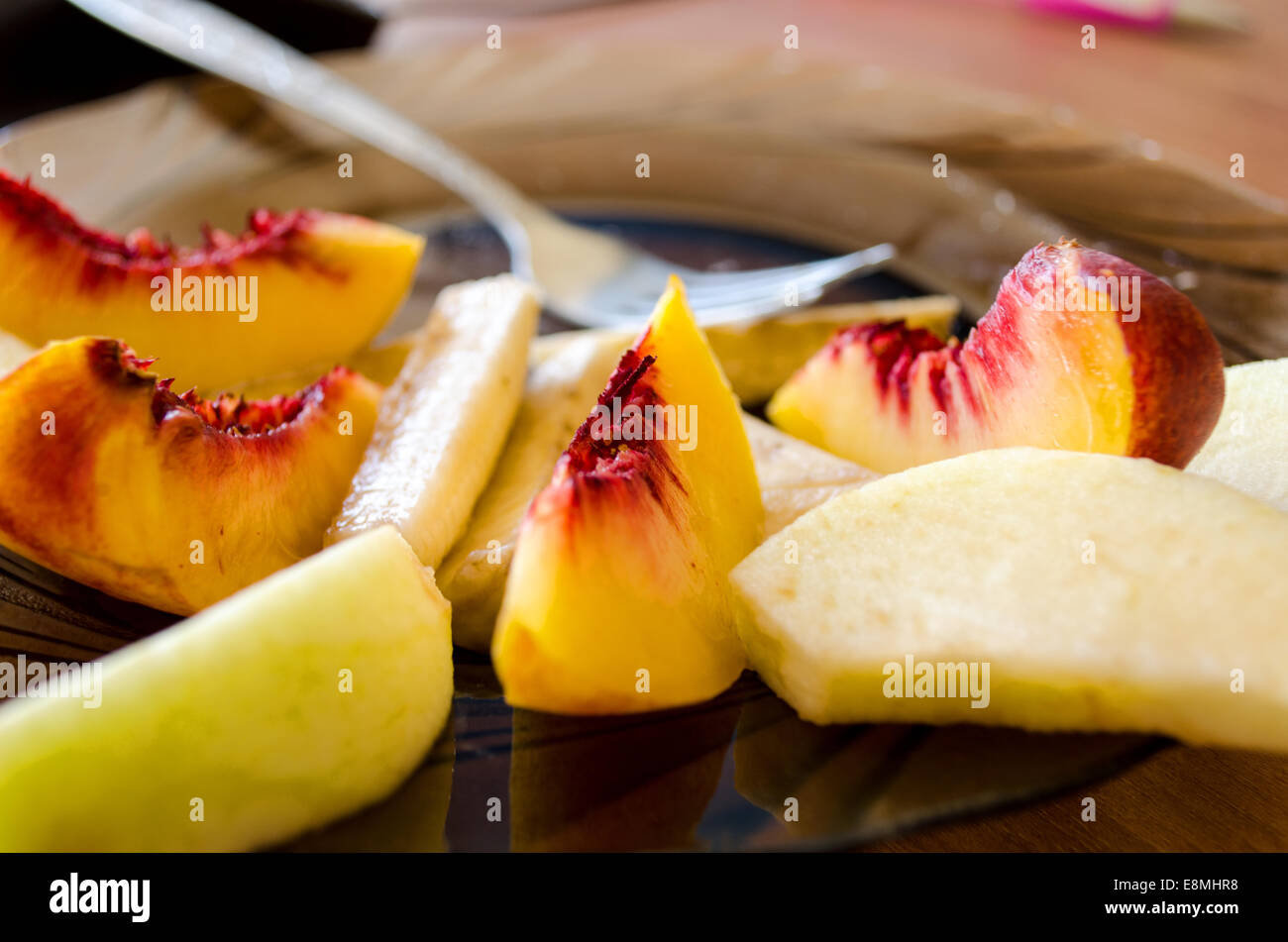 A Nectarine fruit sliced close up view Stock Photo - Alamy