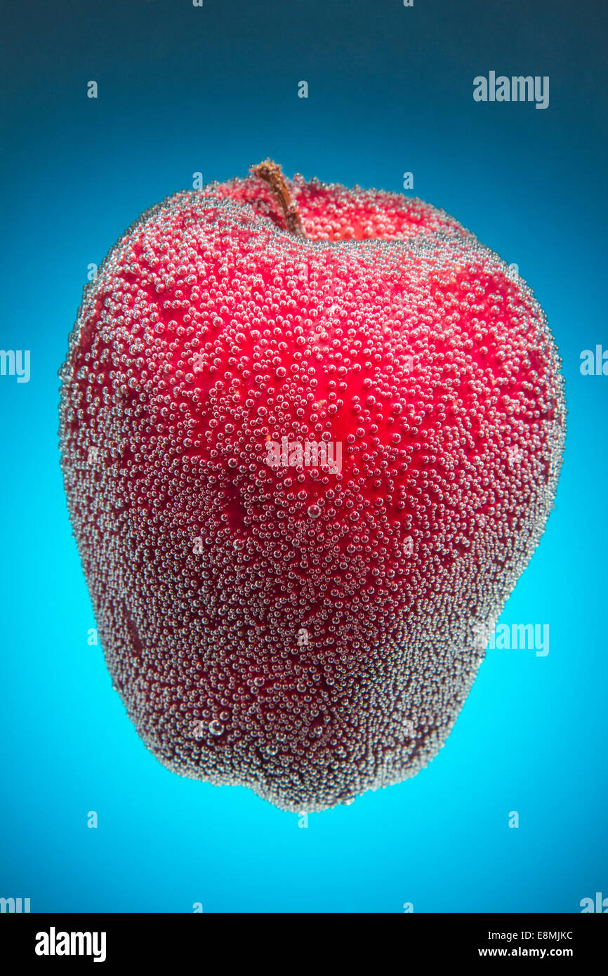 Bright red apple covered in tiny bubbles Stock Photo - Alamy