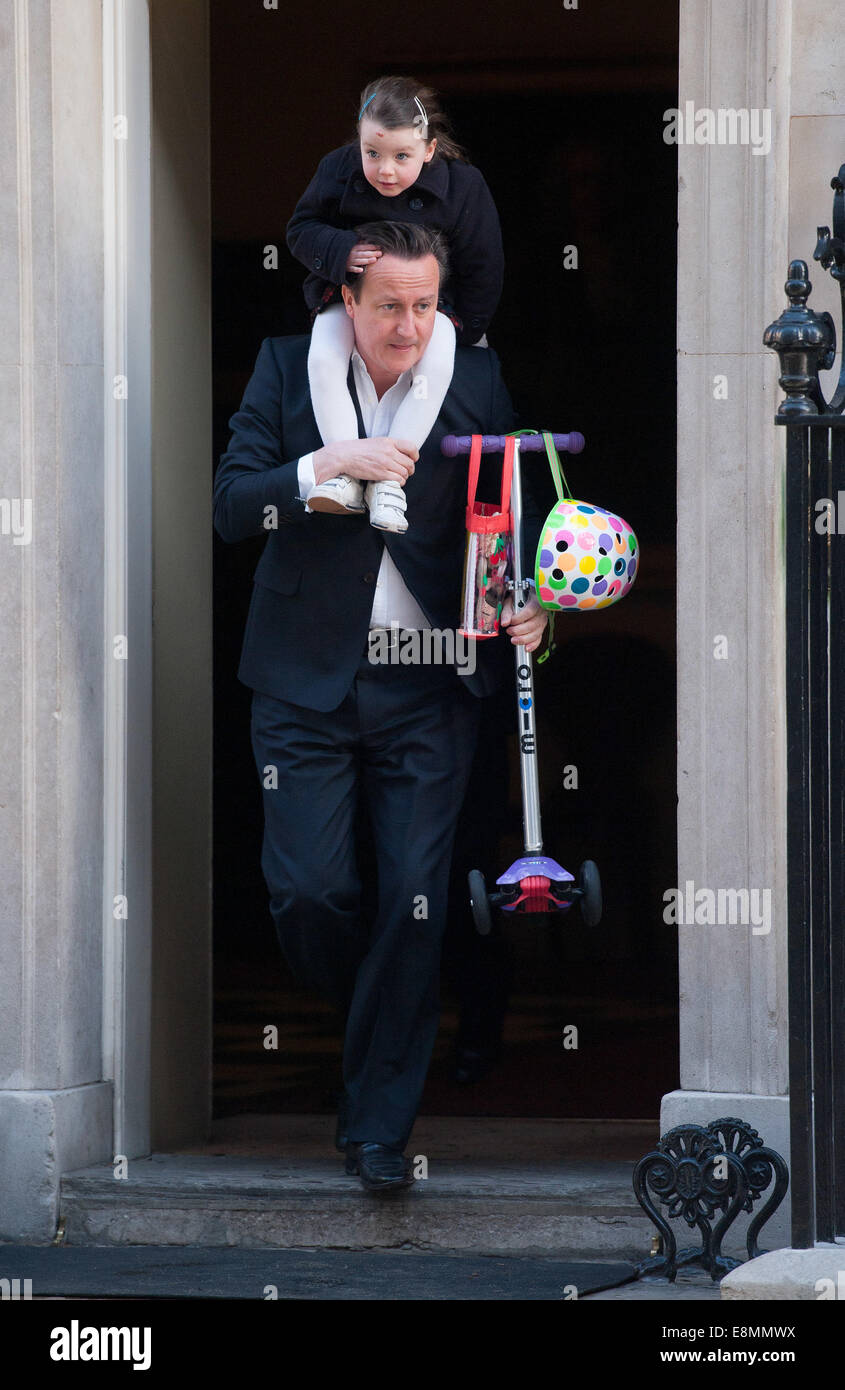 David Cameron leaves Downing Street carrying his daughter Nancy on his ...