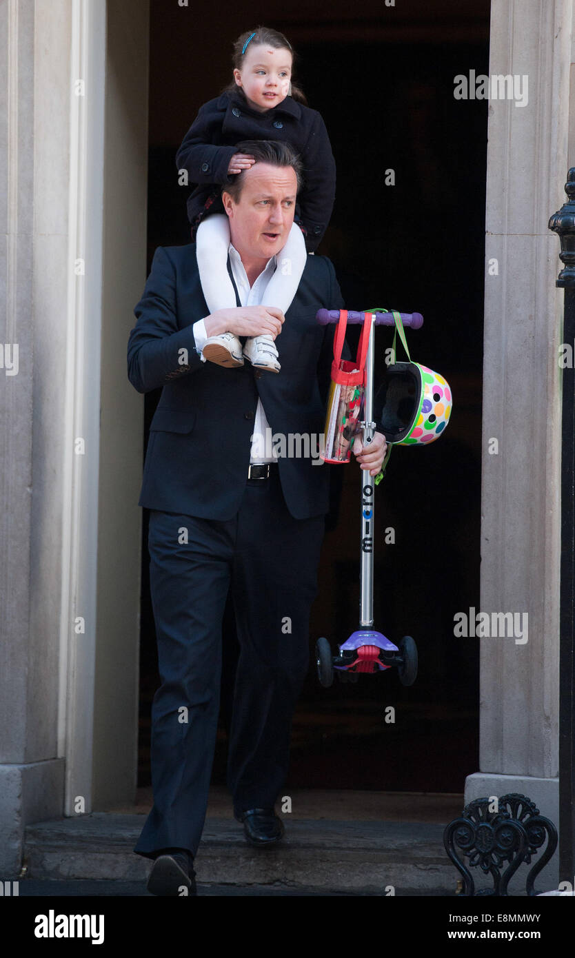 David Cameron leaves Downing Street carrying his daughter Nancy on his ...