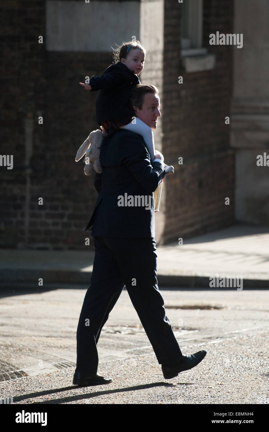 David Cameron leaves Downing Street carrying his daughter Nancy on his ...