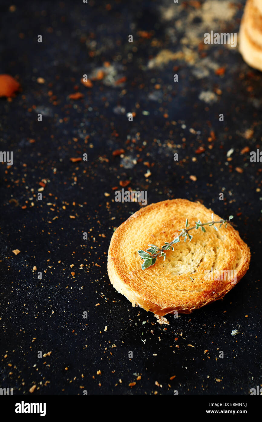 Small toast on black board, top view Stock Photo - Alamy