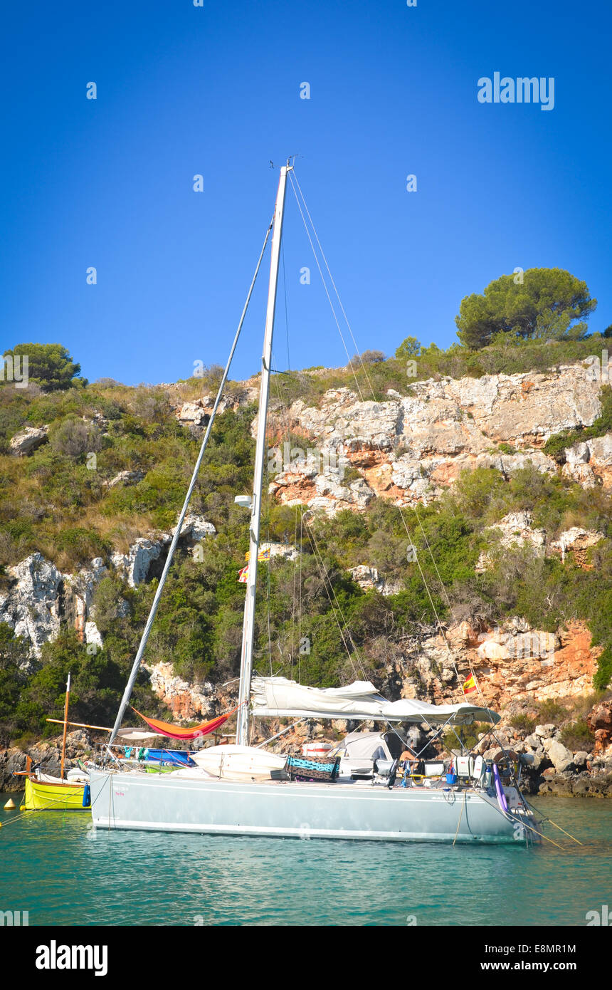 The boats and beach of the small holiday resort, Es Canutells, on the ...