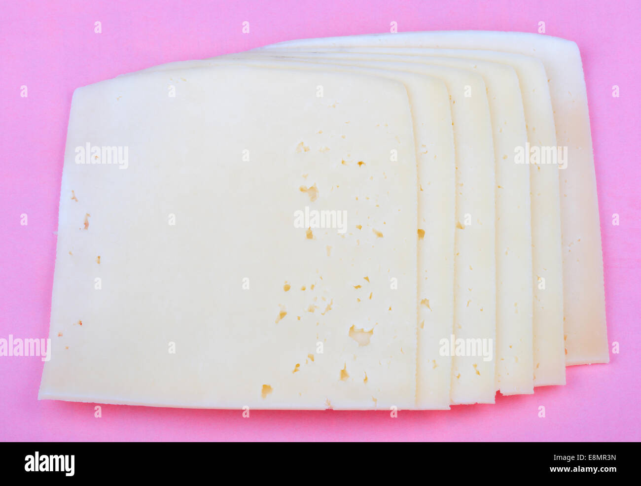 Cheese on Pink Background Stock Photo - Alamy
