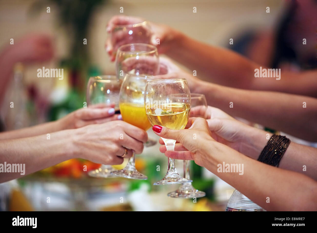 Hands group holding glasses hi-res stock photography and images - Alamy
