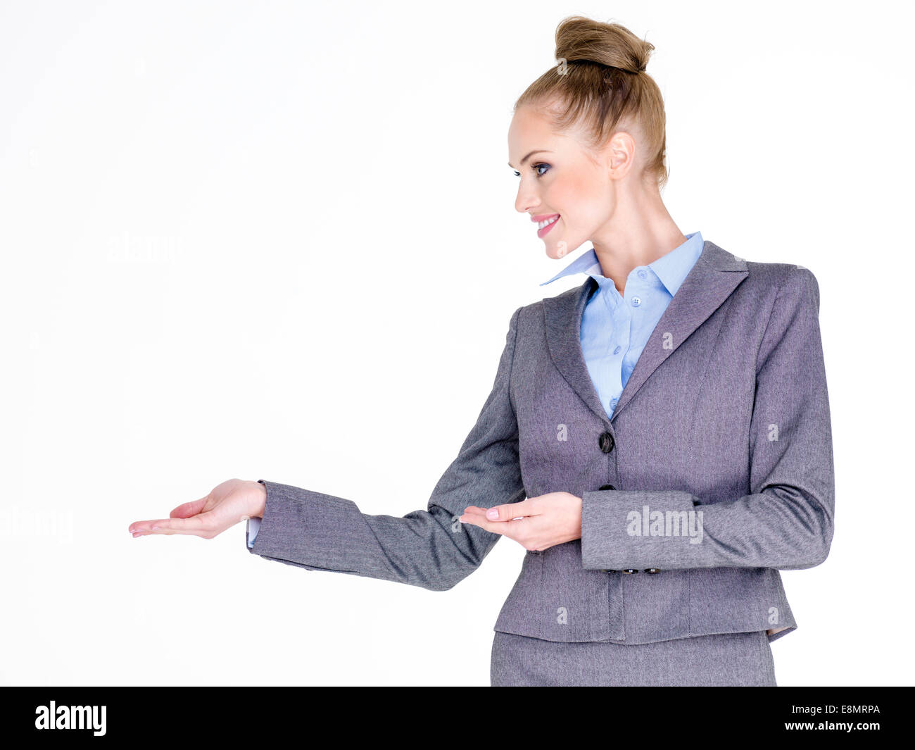 Businesswoman Holding Hands Out to Side Stock Photo - Alamy