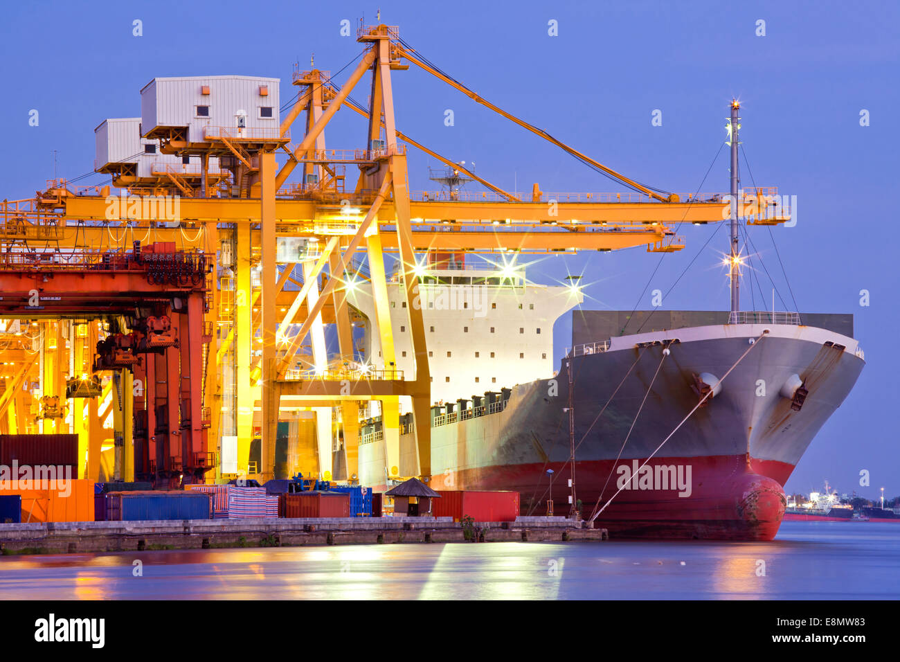 Industrial Container Cargo freight ship with working crane bridge in ...