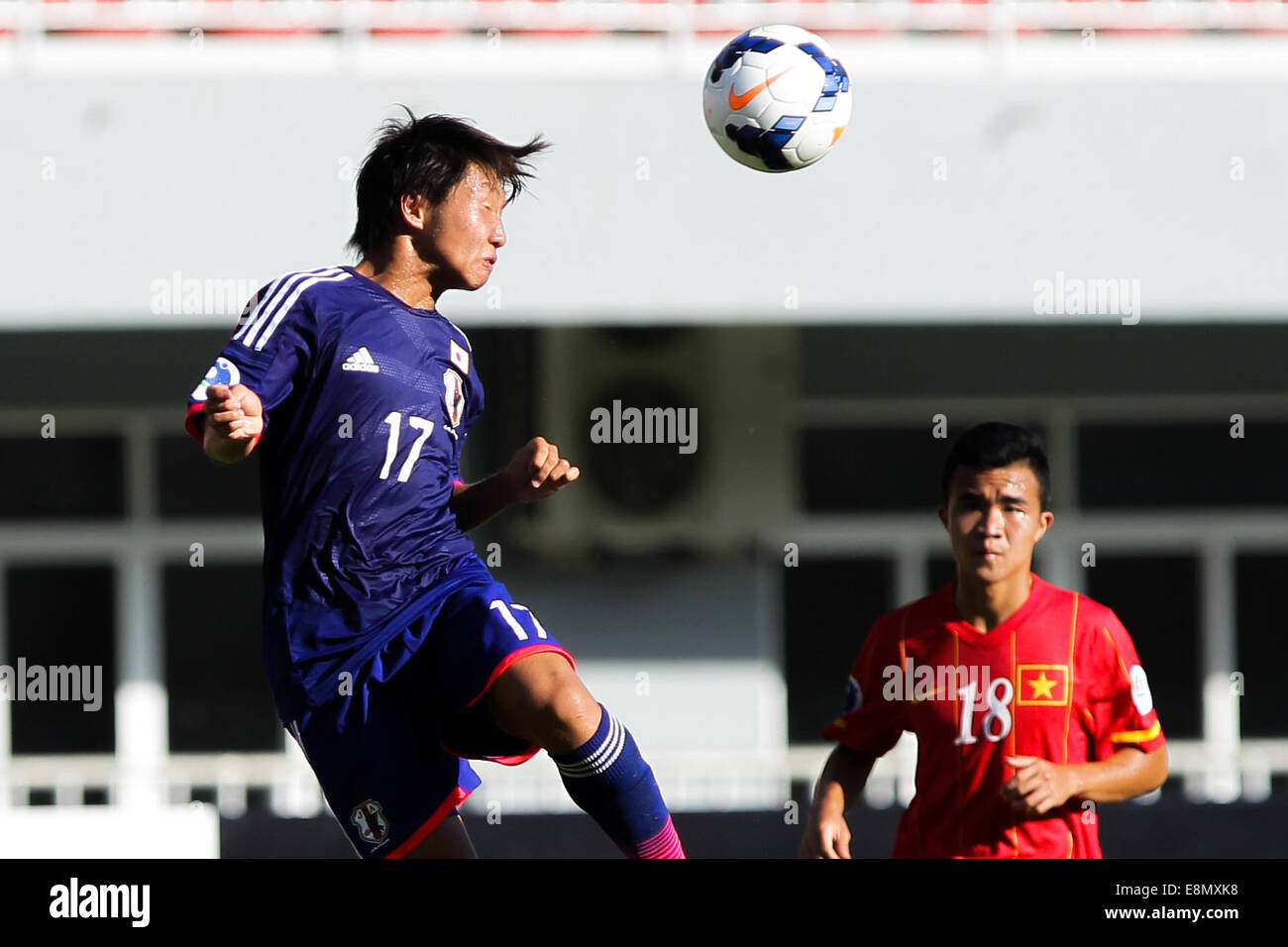 Nay Pyi Taw, Myanmar. 11th Oct, 2014. Sakai (L) of Japan heads the ball ...