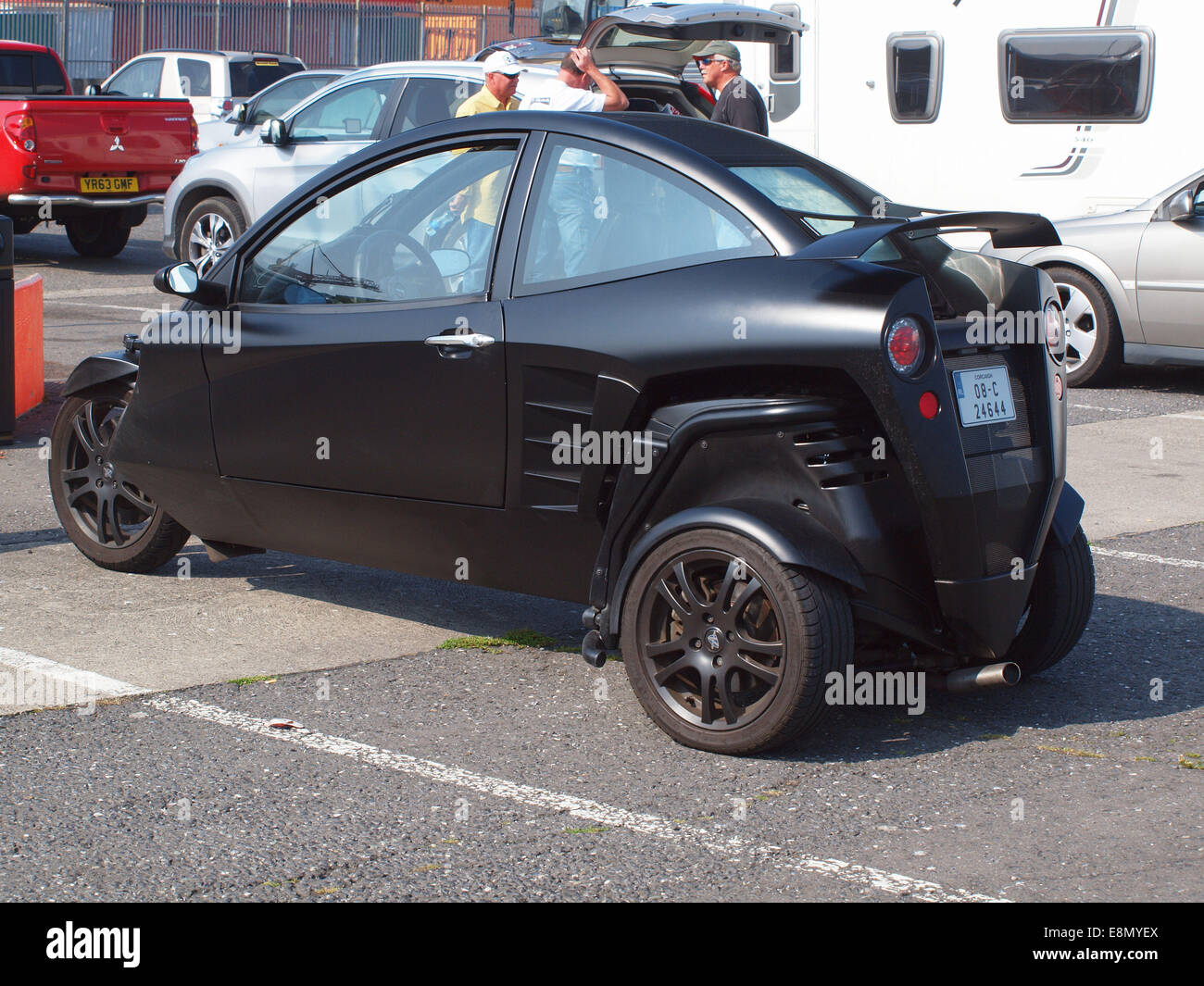 A black three wheeld car parked at Dun Loaghaire Port, Dublin awaiting ...