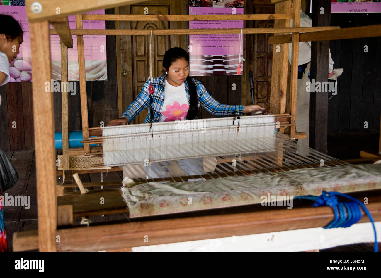 Woman weaves fabric on loom hi-res stock photography and images - Alamy