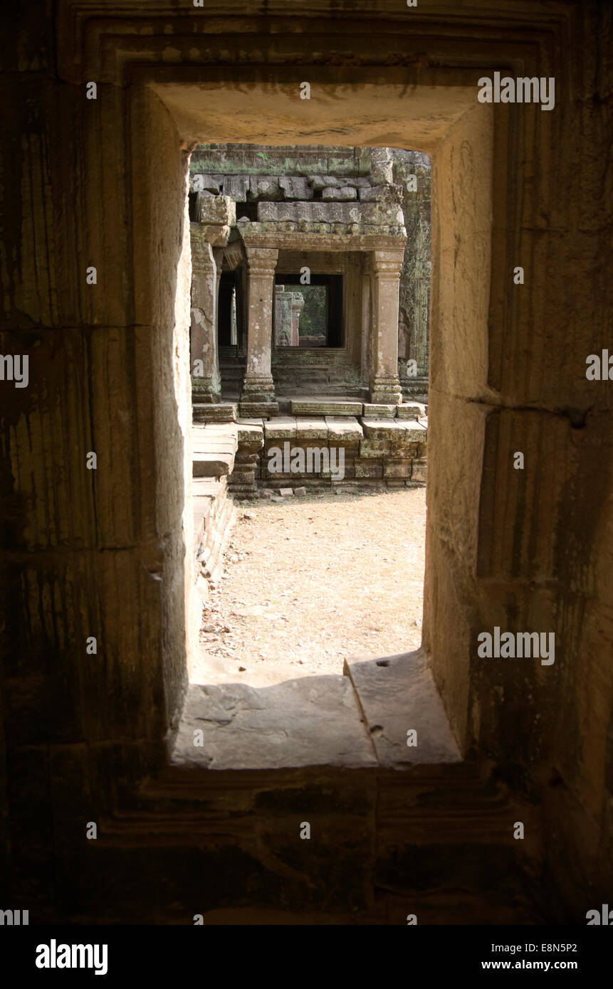 Ta Prohm Temple looking at structure thrugh window frame Stock Photo ...