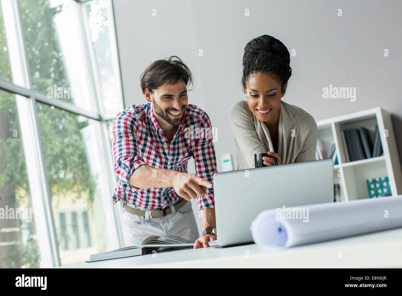 Young people in the office Stock Photo - Alamy