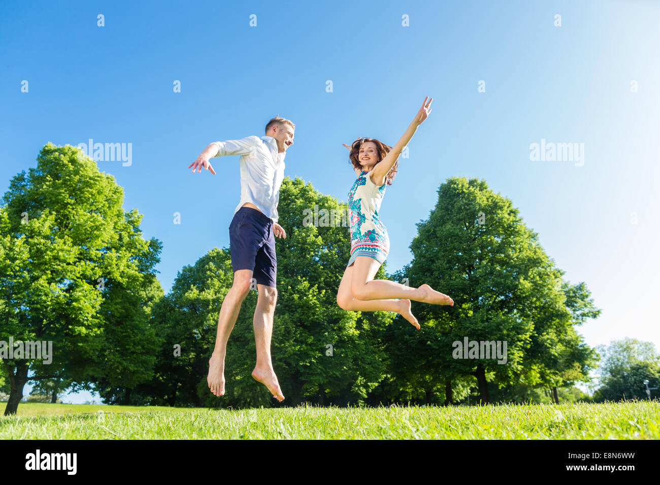 Man woman fun jump on hi-res stock photography and images - Alamy