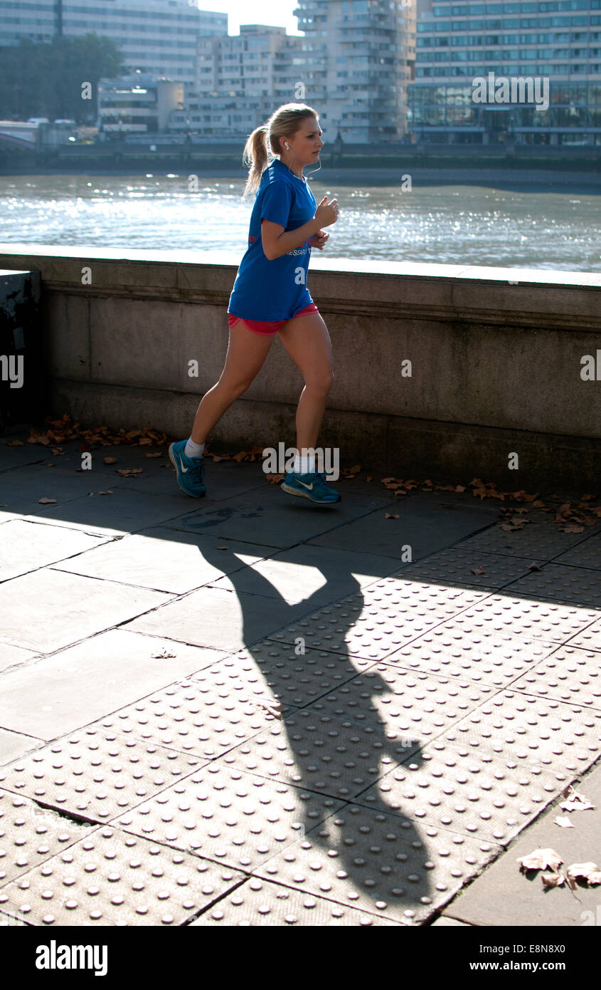 Female runner on Victoria Embankment, London, UK Stock Photo - Alamy