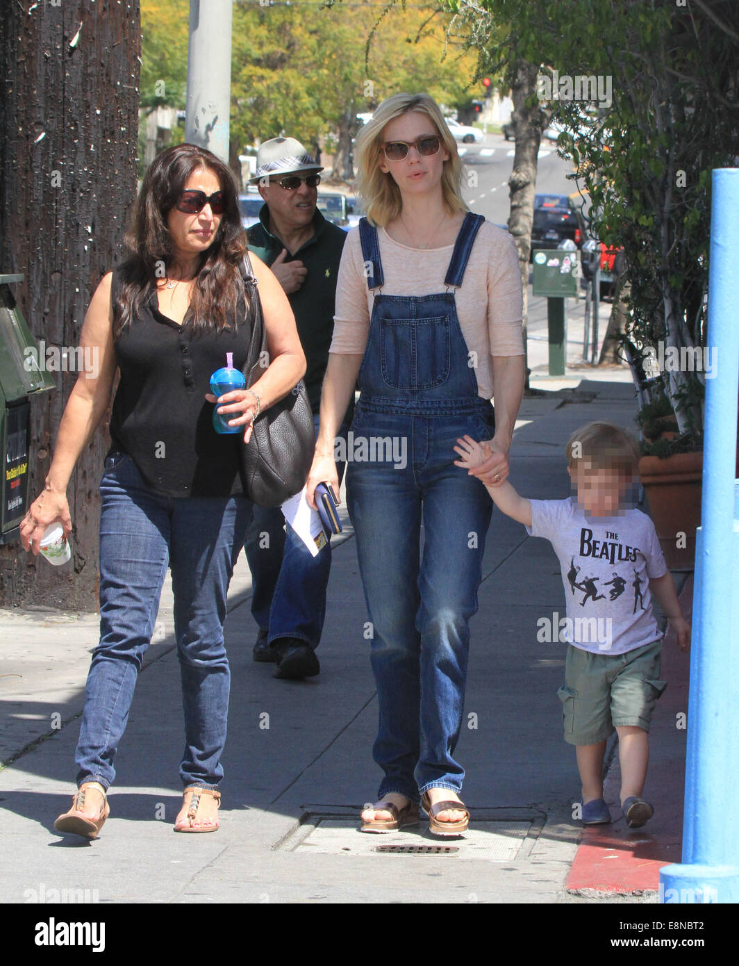January Jones, out and about wearing denim overalls and tortoiseshell ...