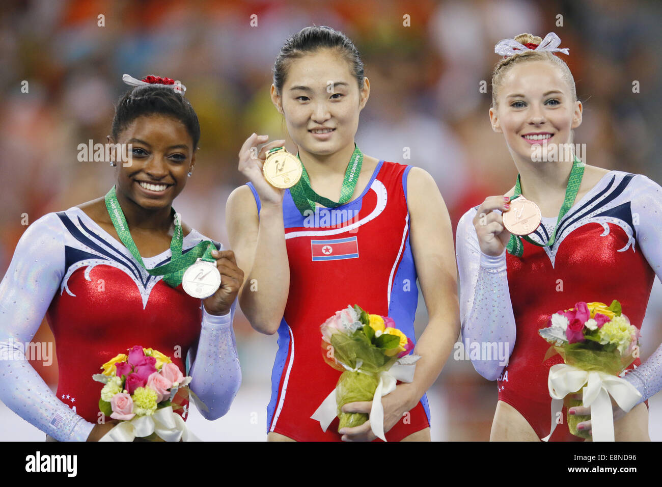 Nanning, China. 11th Oct, 2014. (L-R) Biles Simone (USA), Hong Un Jong ...