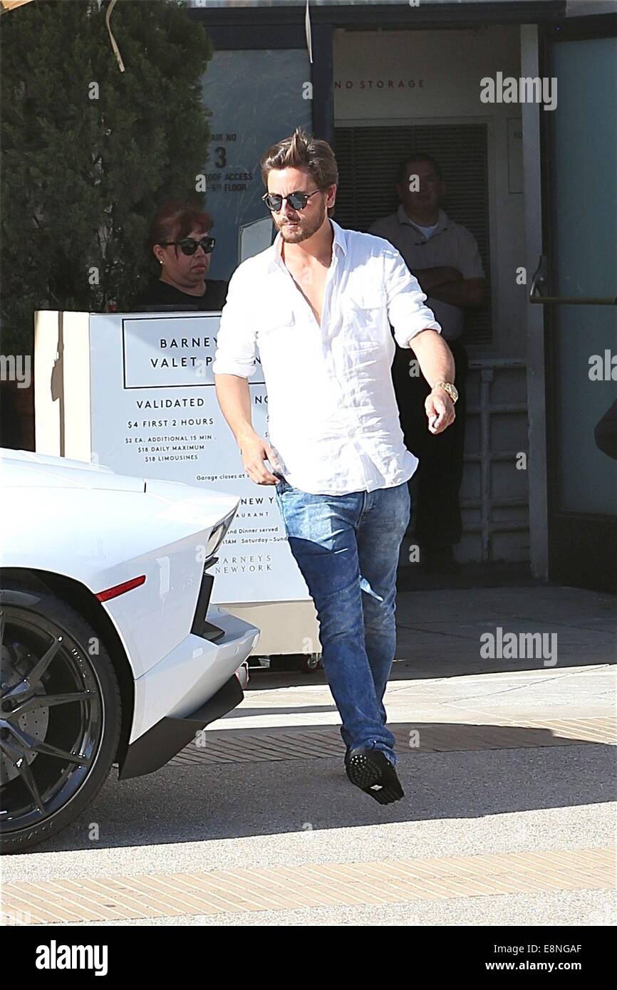 Scott Disick leaving Barneys New York before driving away in a white ...