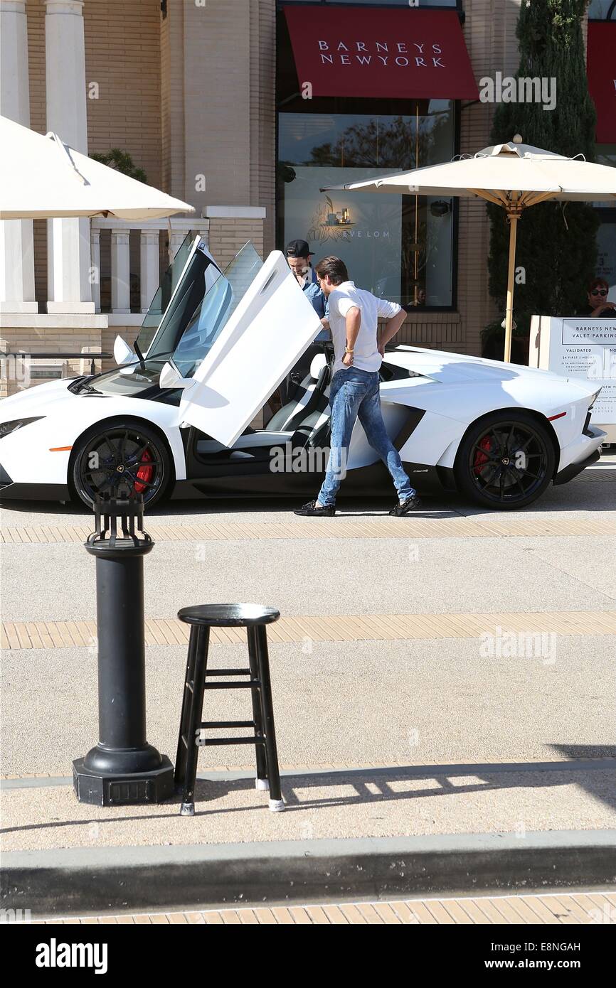 Scott Disick leaving Barneys New York before driving away in a white ...