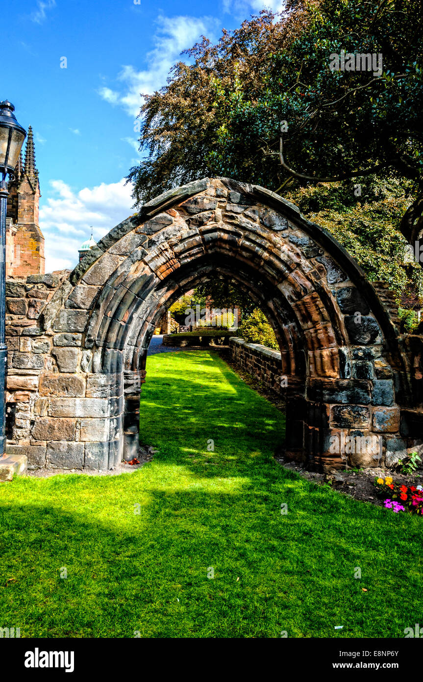 The ruins of a wall and a pointed-arched doorway which probably led ...