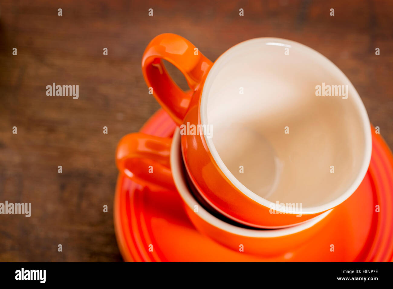 two empty stacked coffee cups on a grunge wood table, shallow depth of ...