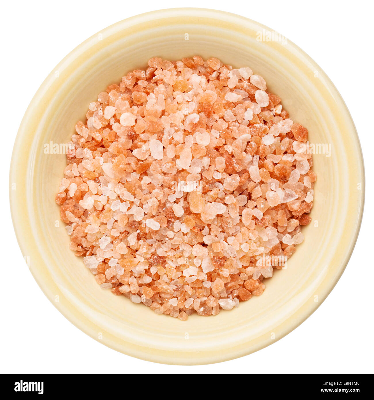 Himalayan salt coarse crystals in a ceramic bowl isolated on white ...