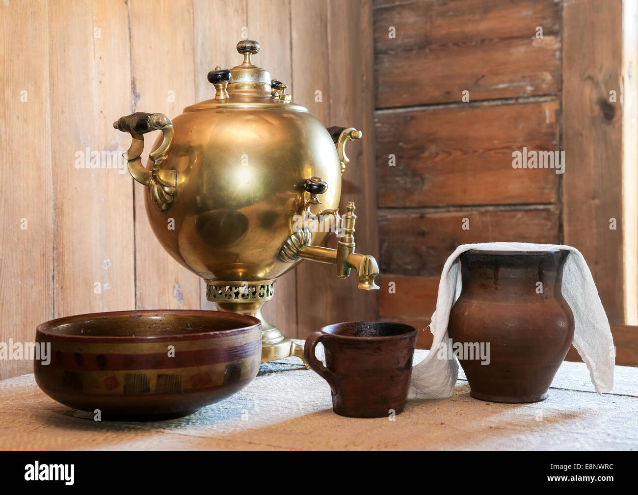 Old samovar and ceramic dishes on a table in a country house Stock ...