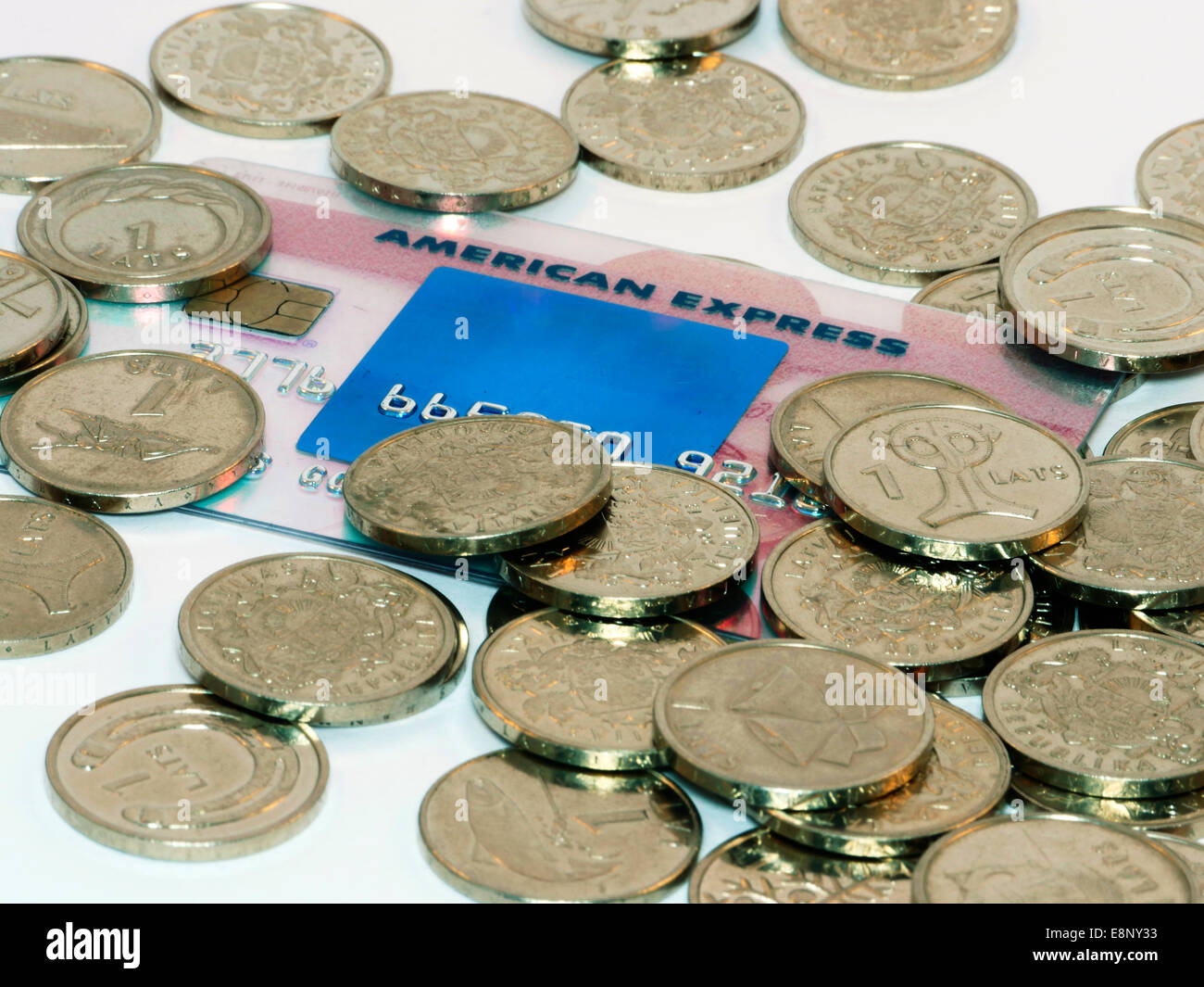 Bunch of coins with credit card - American express and mastercard Stock ...
