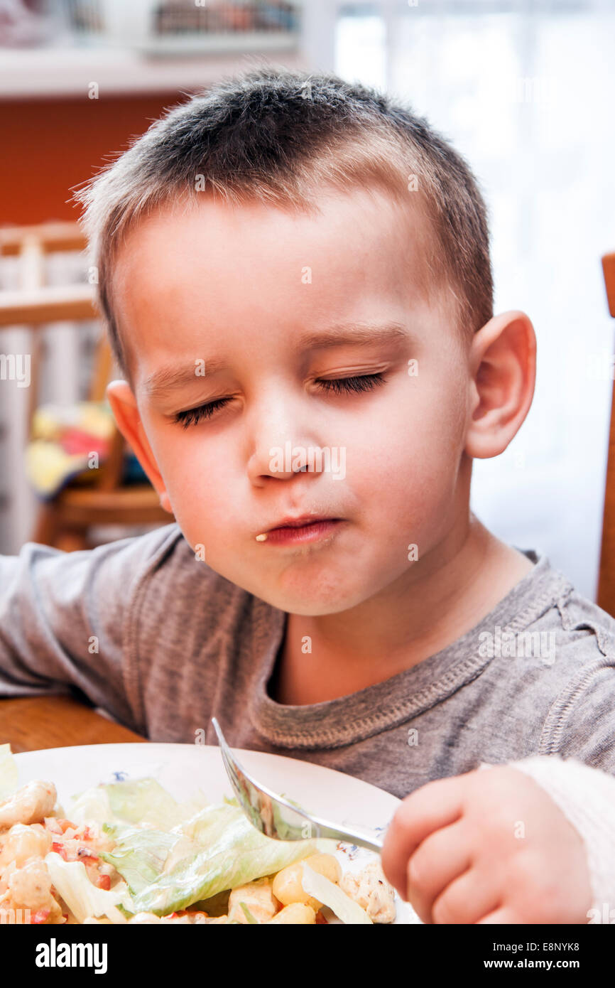 little boy at the kitchen table with food Stock Photo - Alamy