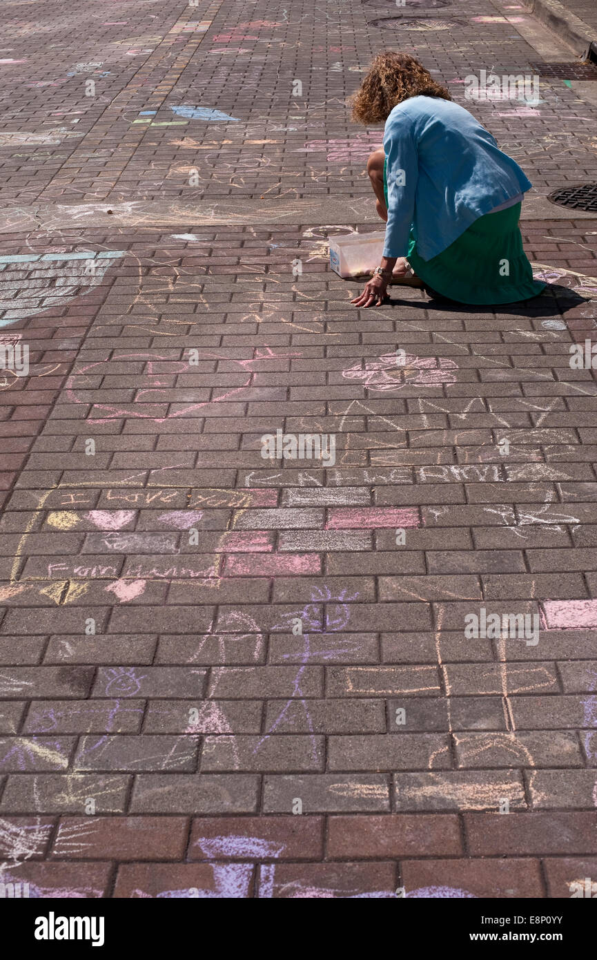 Chalk painting woman artist Stock Photo - Alamy