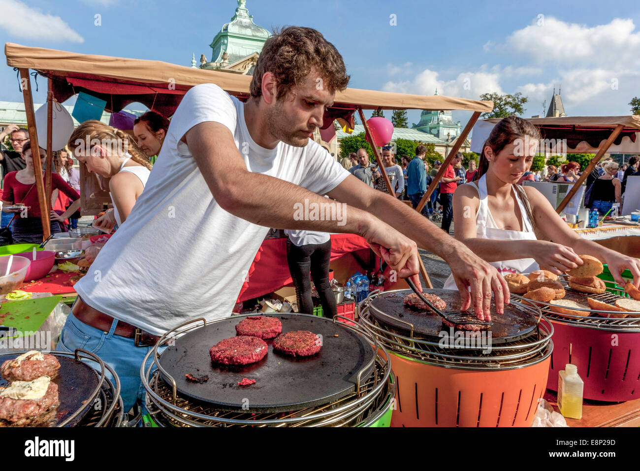 Prague food market, Prague Street food stall, Man make a burger Prague ...