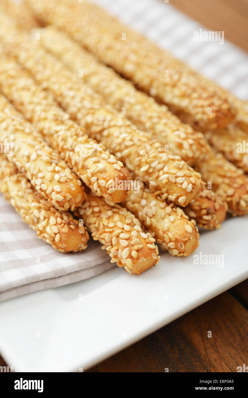Bread sticks with sesame seeds on plate closeup Stock Photo - Alamy