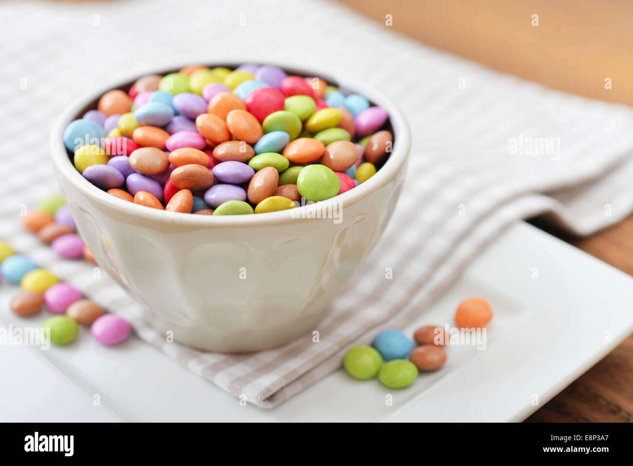 Sweet round multicolor candies in bowl closeup Stock Photo - Alamy