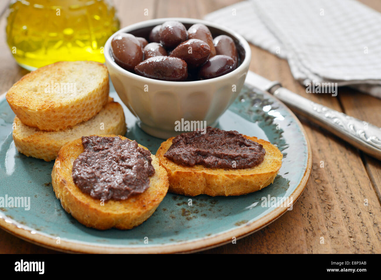 Bread with olive pate on plate closeup. Greek cuisine Stock Photo - Alamy