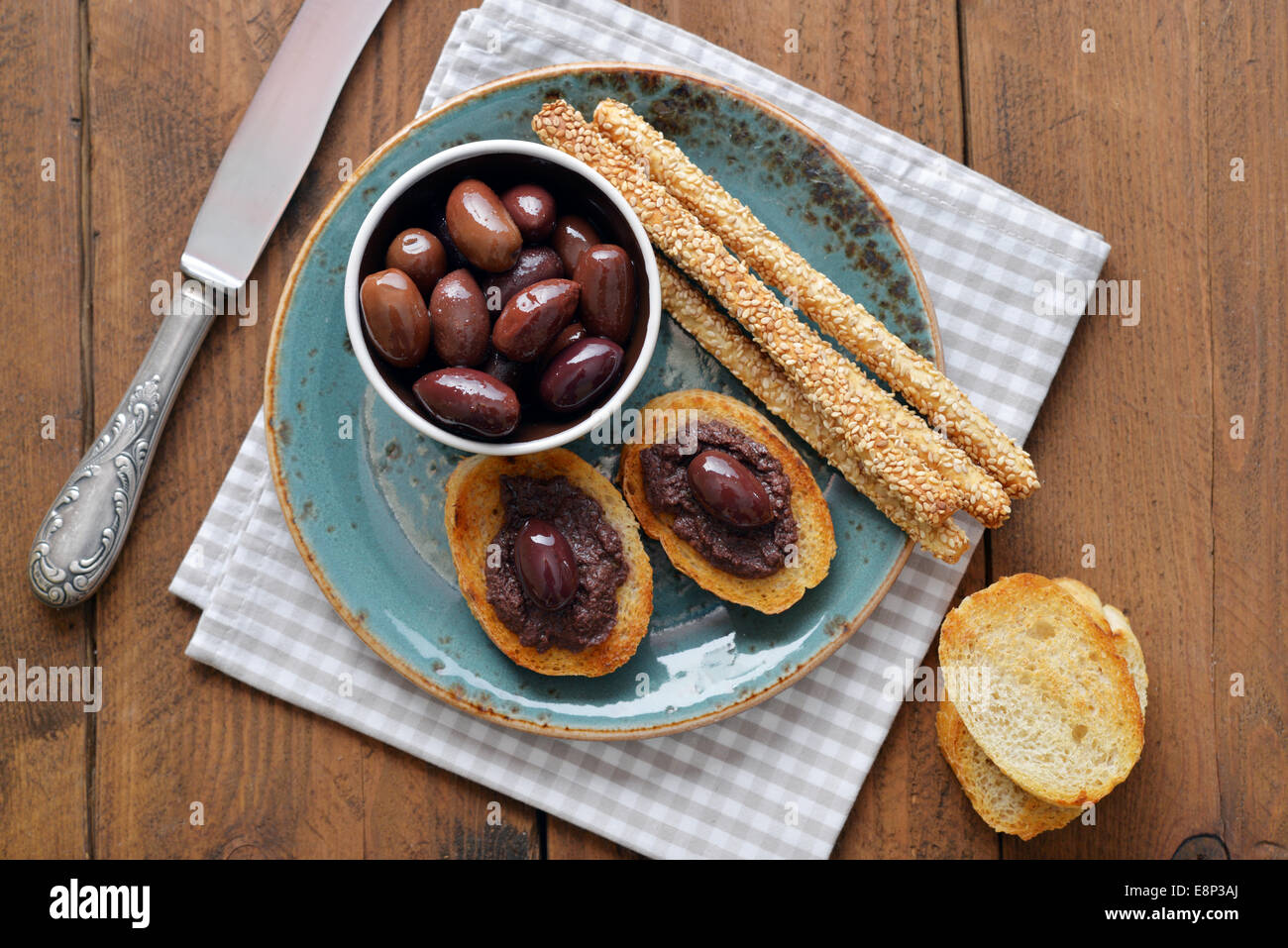 Bread with olive pate on plate closeup. Greek cuisine Stock Photo - Alamy