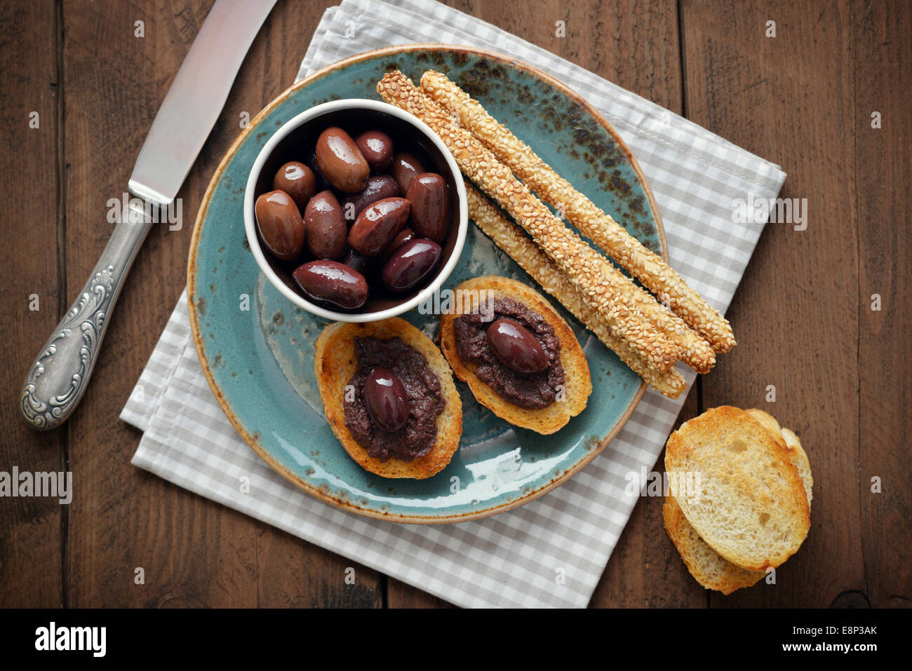 Bread with olive pate on plate closeup. Greek cuisine Stock Photo - Alamy