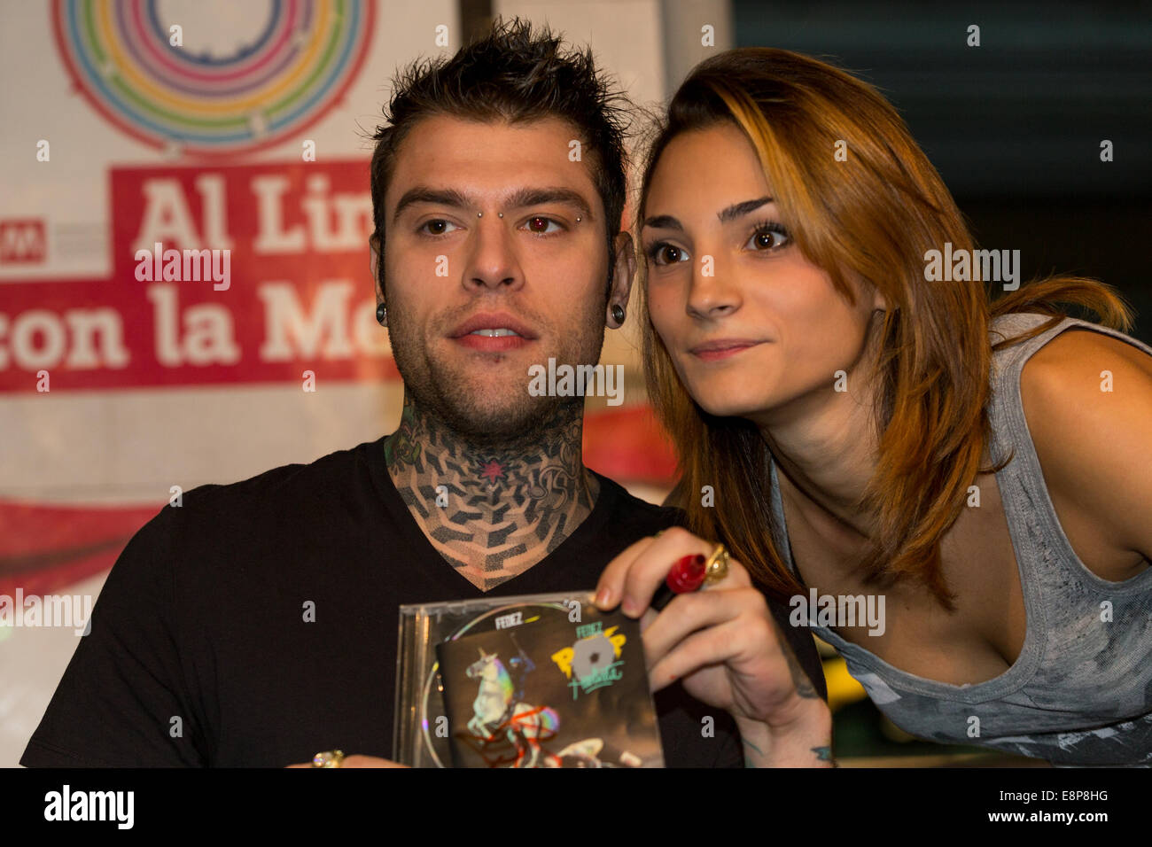Turin, Italy. 12th October, 2014. Fedez with his fan pose for a picture ...