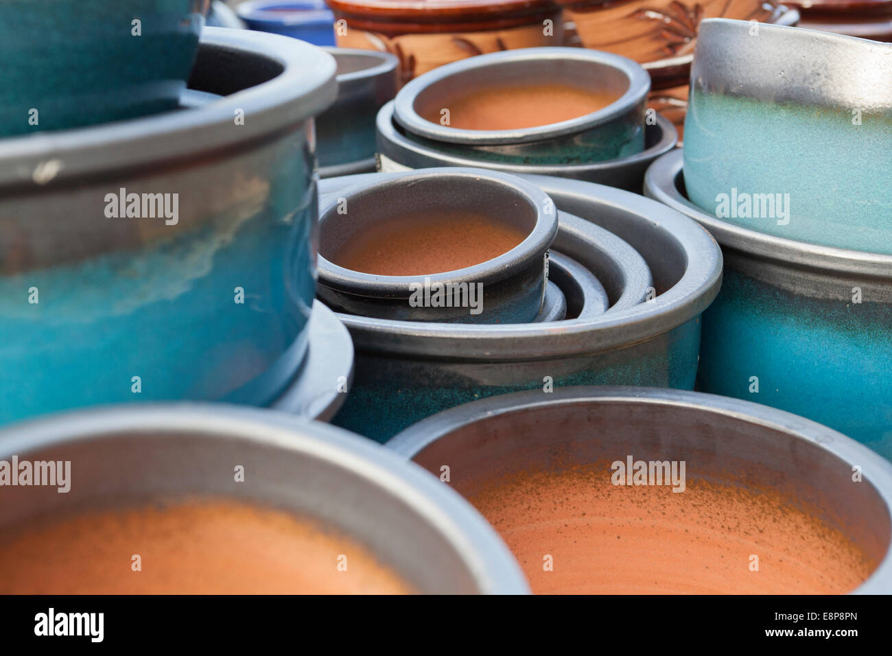 Stack of colorful pottery garden pots Stock Photo - Alamy