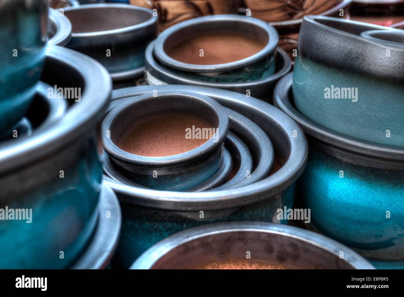 Stack of colourful pottery garden pots Stock Photo - Alamy