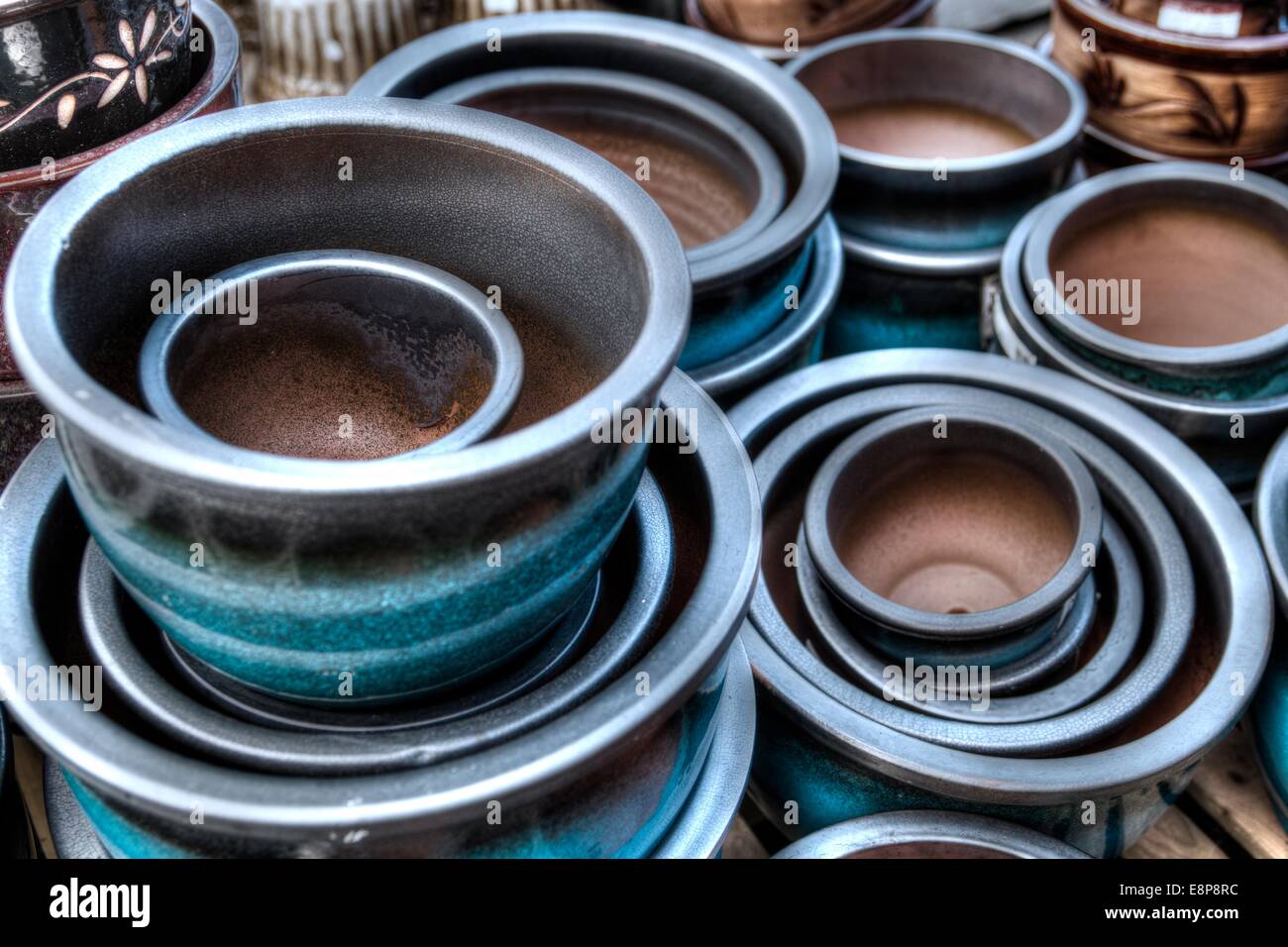 Stack of colorful pottery garden pots Stock Photo - Alamy