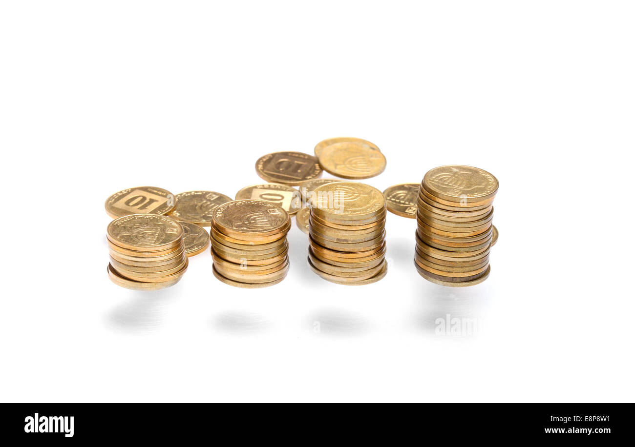 Vertical money stacks with scattered coins over white background Stock ...