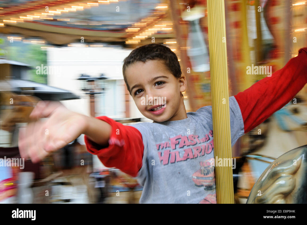 Children merry go round playground hi-res stock photography and images ...