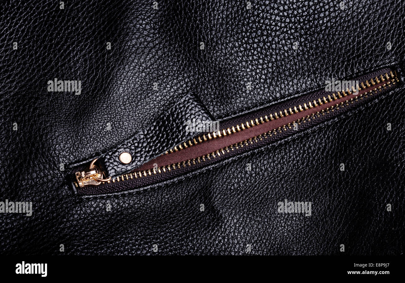 Faux leather background with open zip fastener Stock Photo - Alamy
