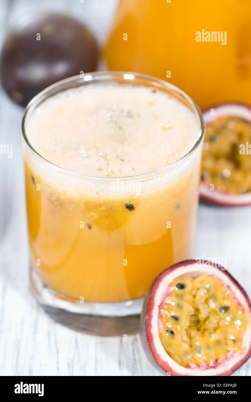 Fresh homemade Maracuja Juice in a glass with some fresh fruits Stock ...