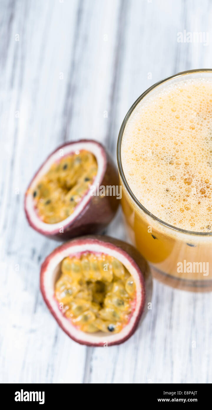 Fresh homemade Maracuja Juice in a glass with some fresh fruits Stock ...