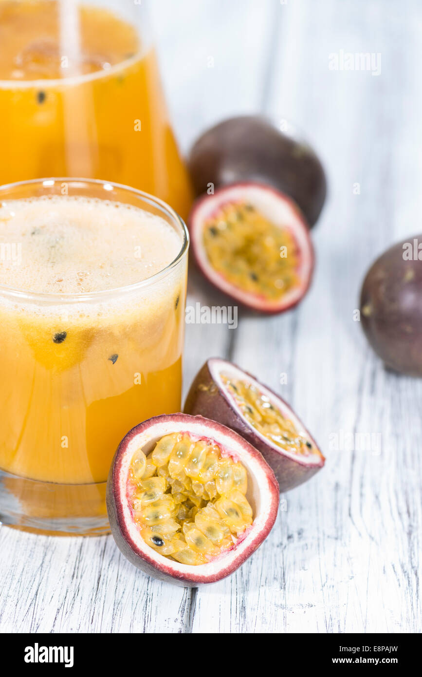 Fresh made Maracuja Juice on wooden background (close-up shot Stock ...