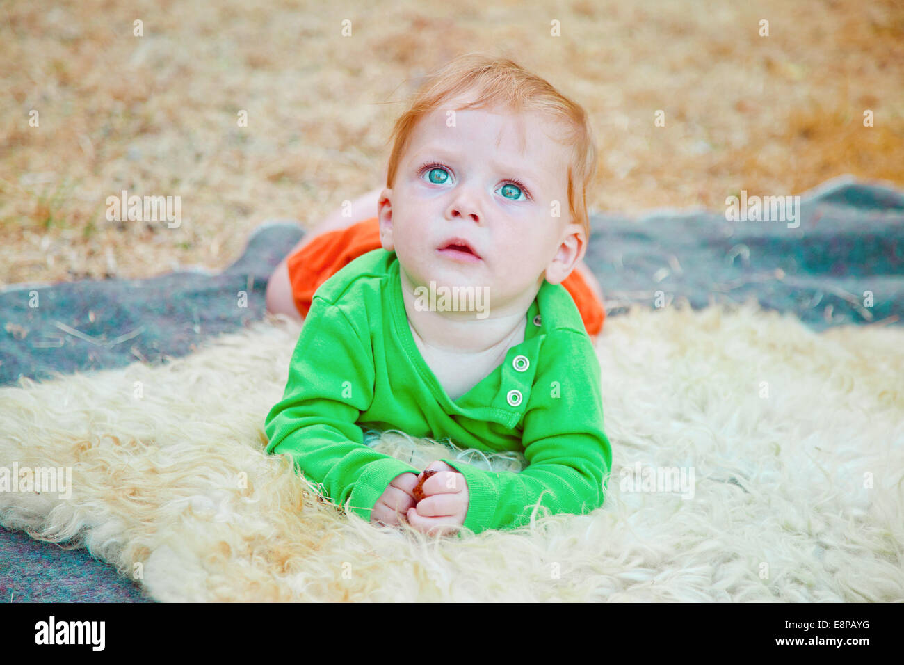 Portrait of a cute startled baby boy staring up in awe Stock Photo - Alamy