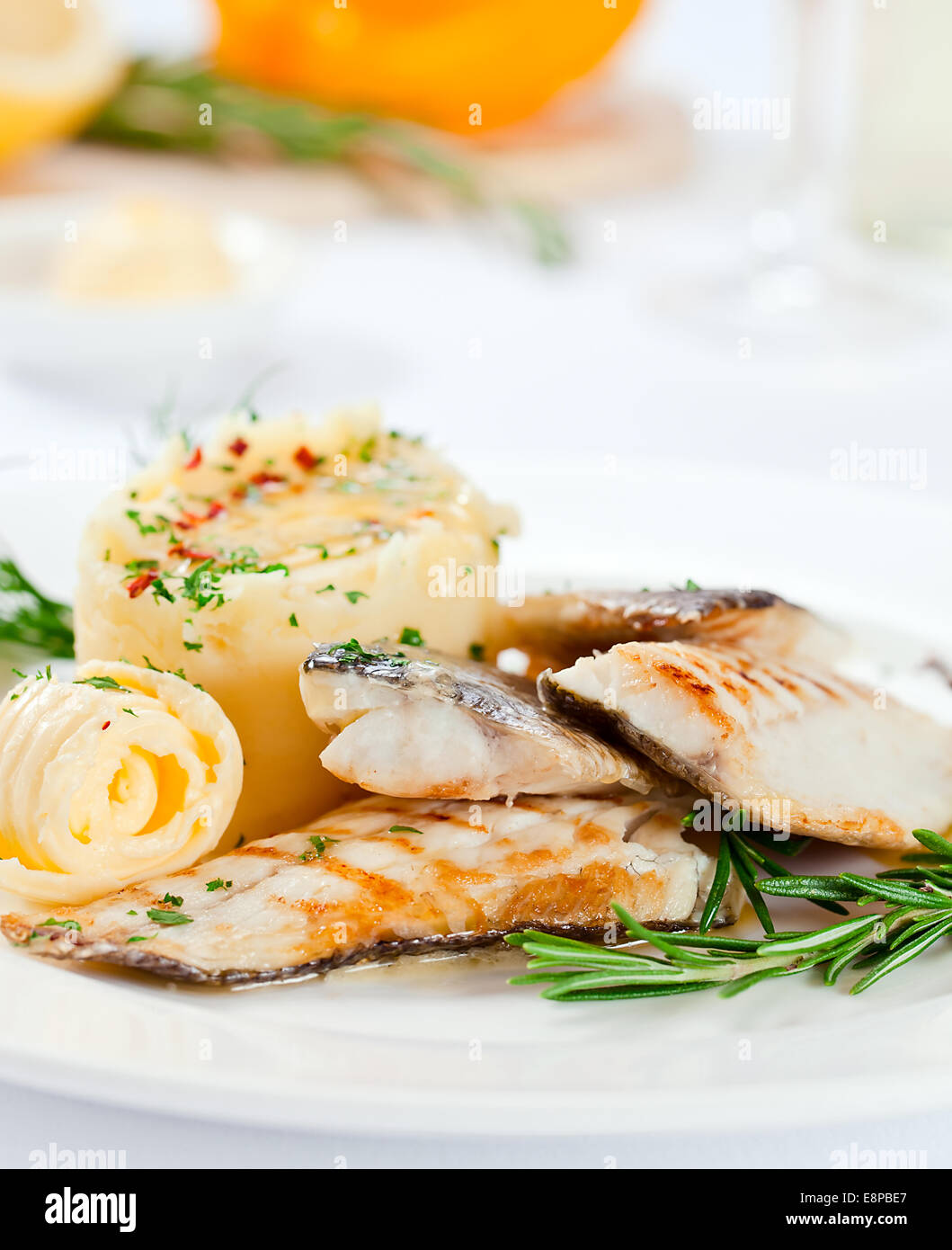 baked fish with potatoes,rosemary and spices Stock Photo - Alamy